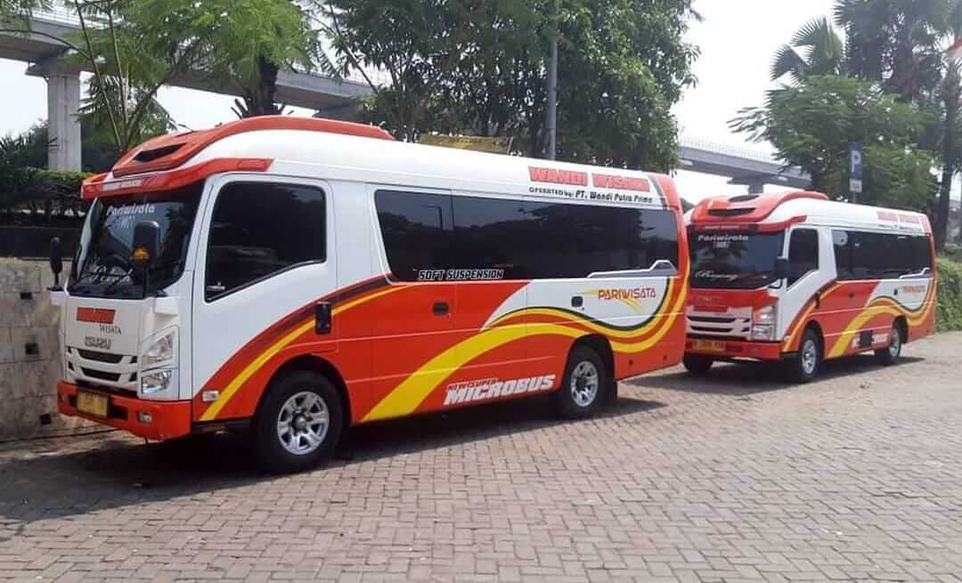 Mobil Elf Long, Spesifikasi dan Kapasitas Kursi Isi Berapa? - Wandi Trans